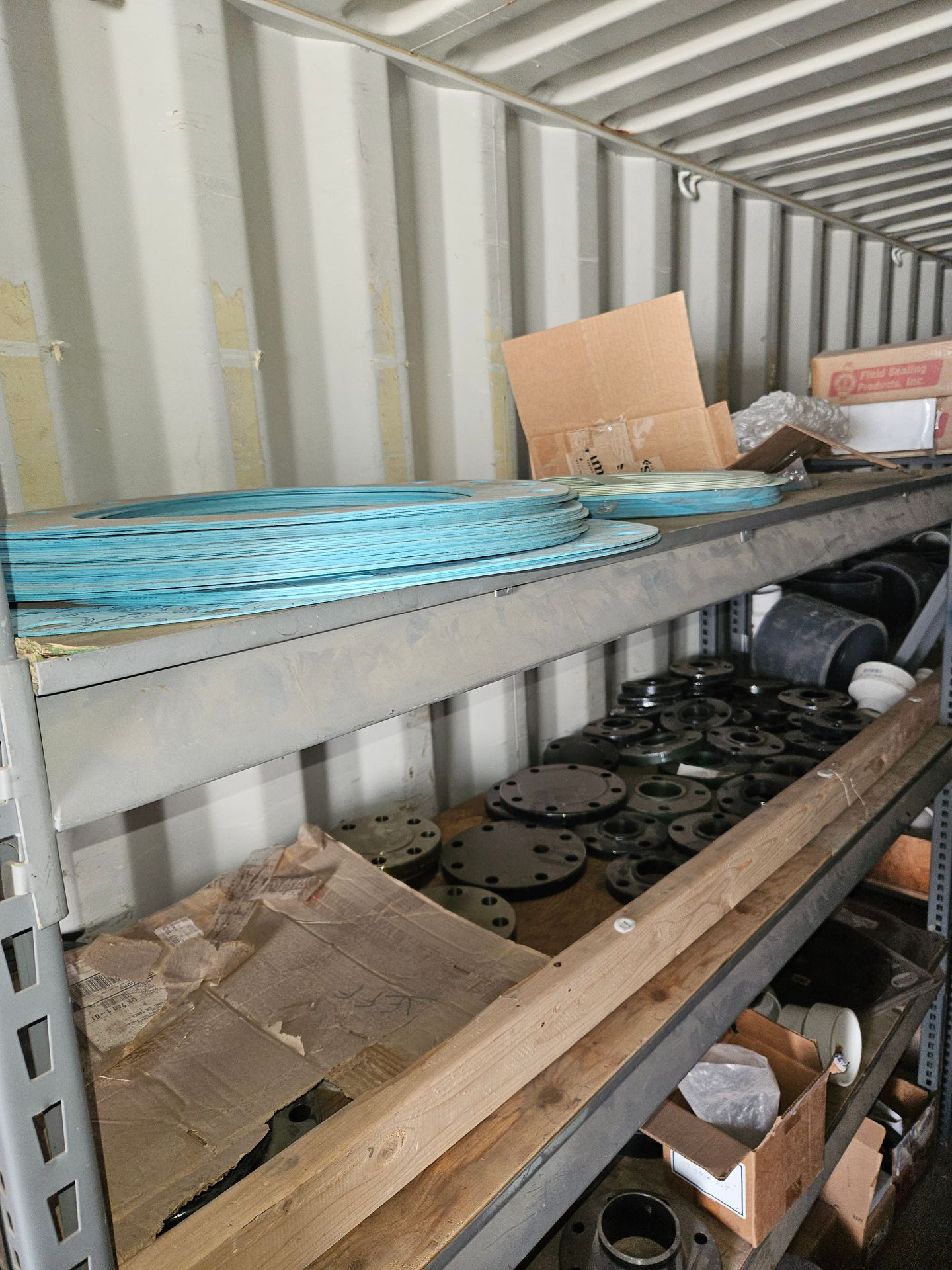 20' SHIPPING CONTAINER W/ SHELVING AND MISC SUPPLIES