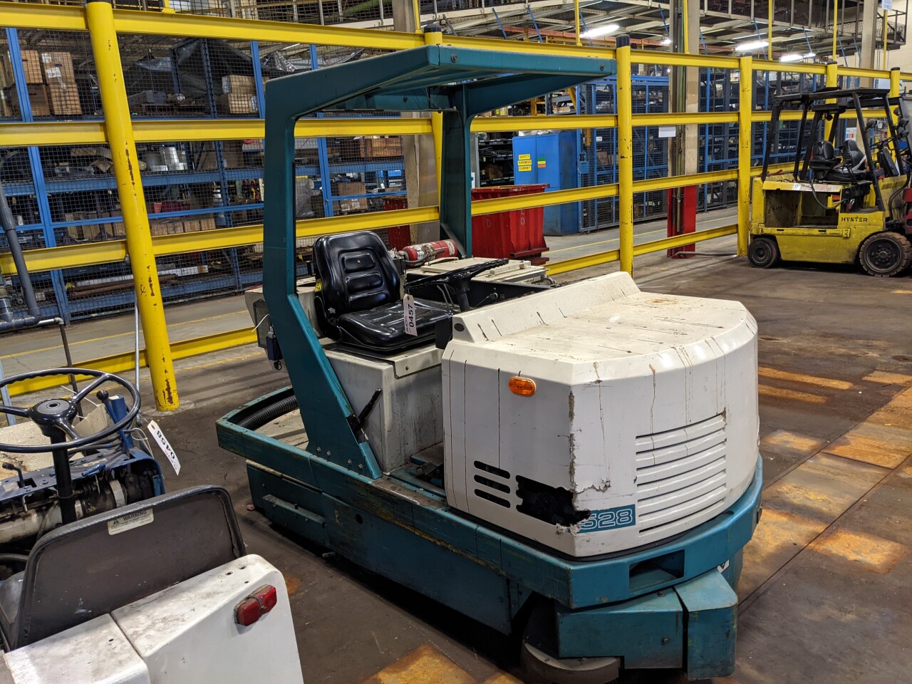 INDUSTRIAL RIDE ON SWEEPER, 66-INCH CLEANING PATH, OVERHEAD CAGE