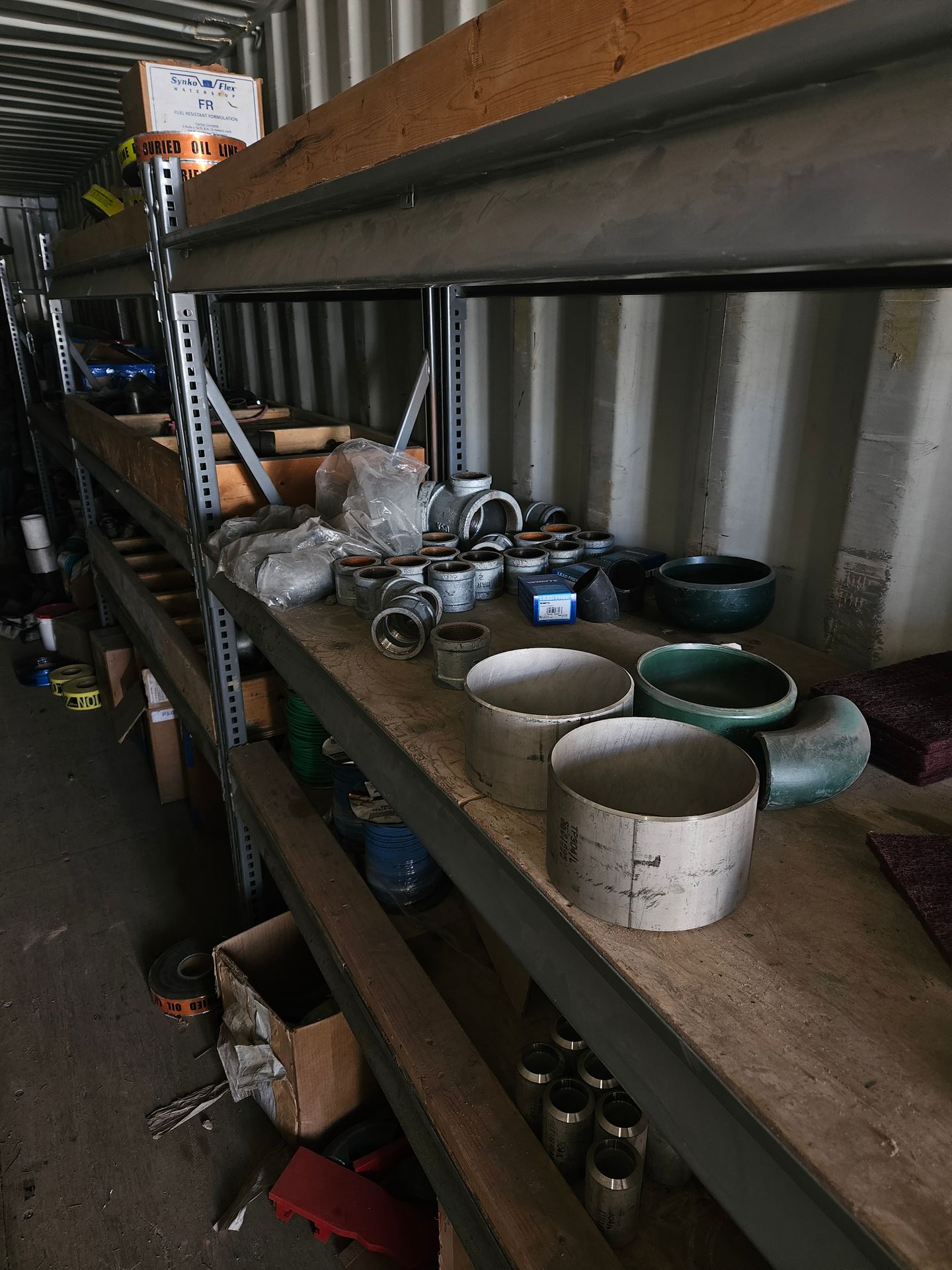 20' SHIPPING CONTAINER W/ SHELVING AND MISC SUPPLIES